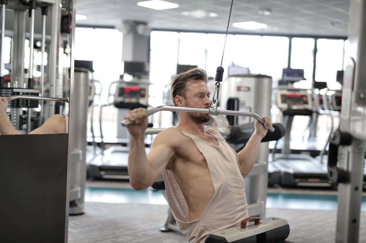 Maximize Your Lat Pull Down Bar Workout in the Gym 2024